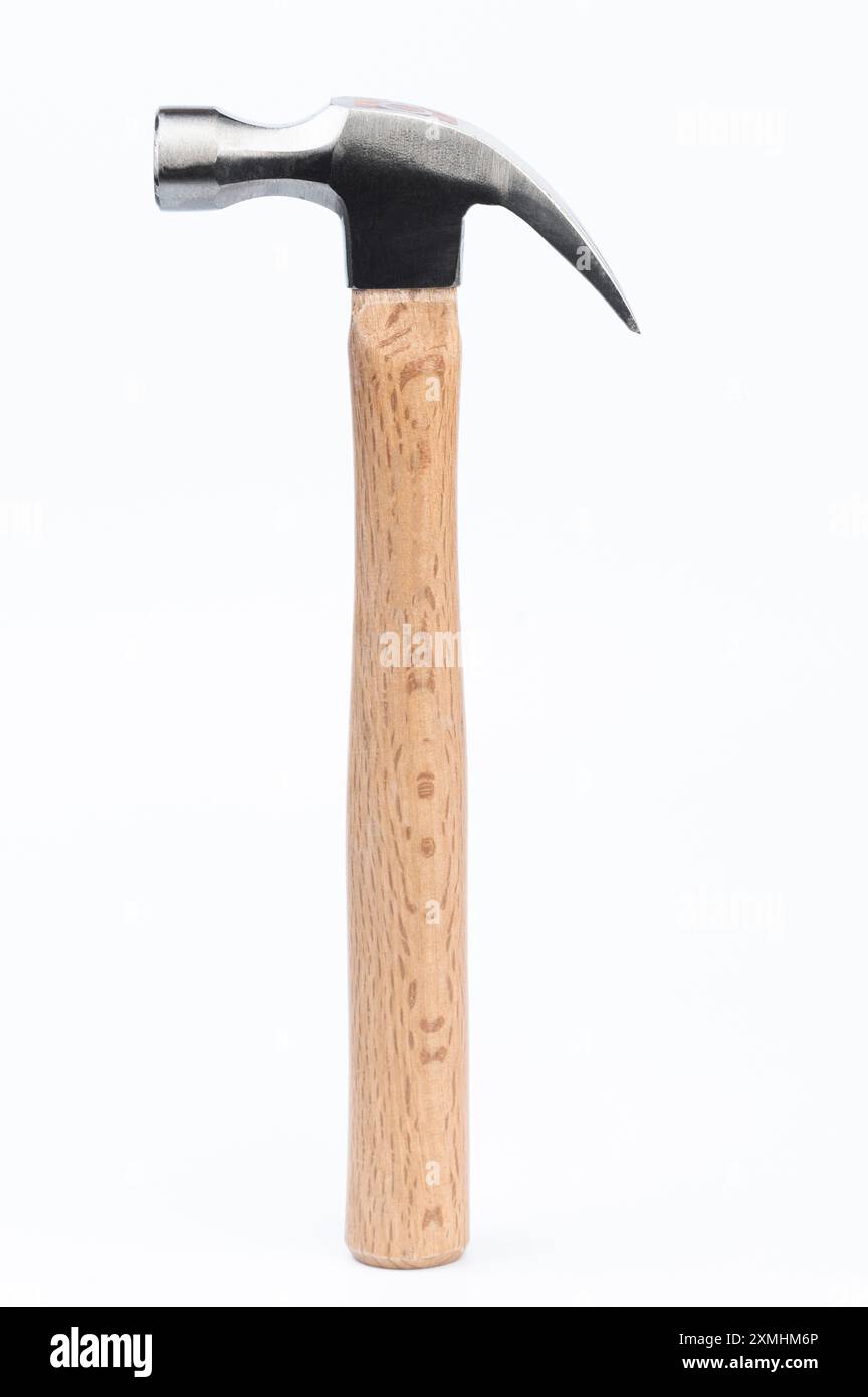 Classic hammer with metal head and wood handle stand vertical isolated ...