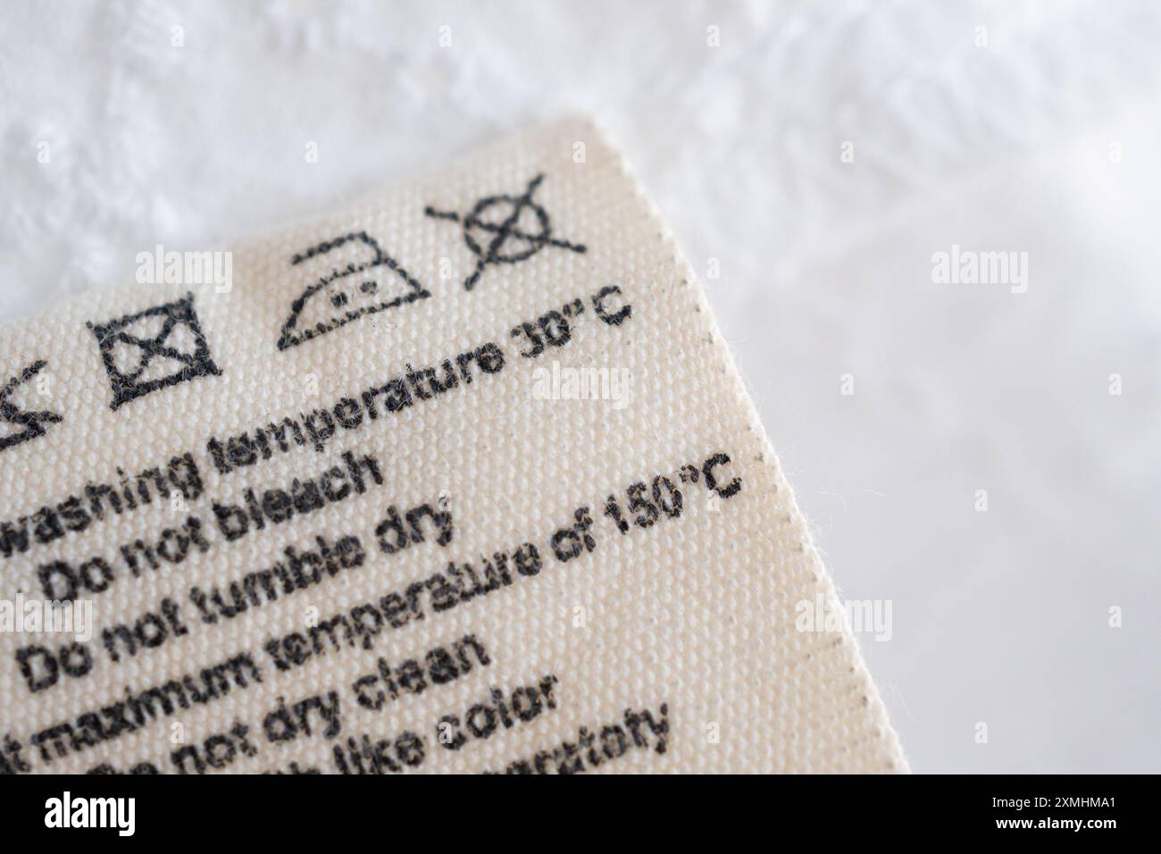laundry care washing instructions clothes label on fabric texture ...