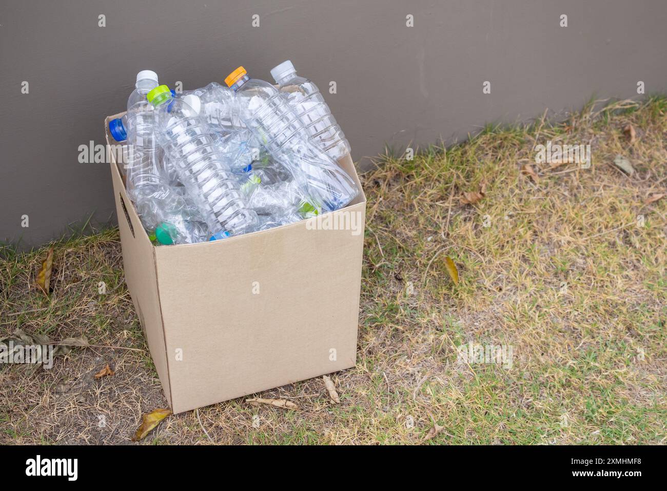 plastic bottles in brown recycle garbage box Stock Photo - Alamy