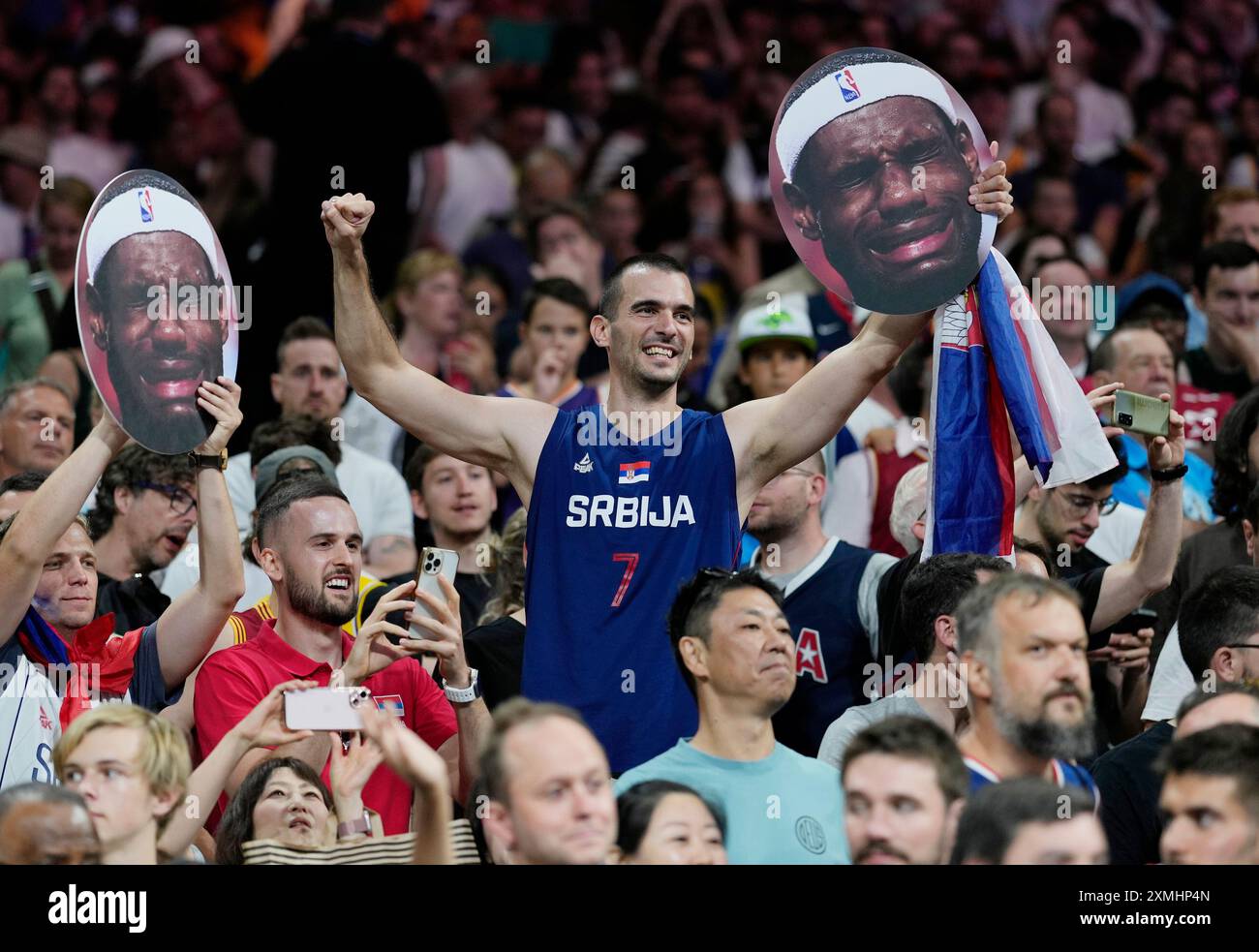Paris, France. 28th July, 2024. A fan of Team Serbia holds photos of a ...