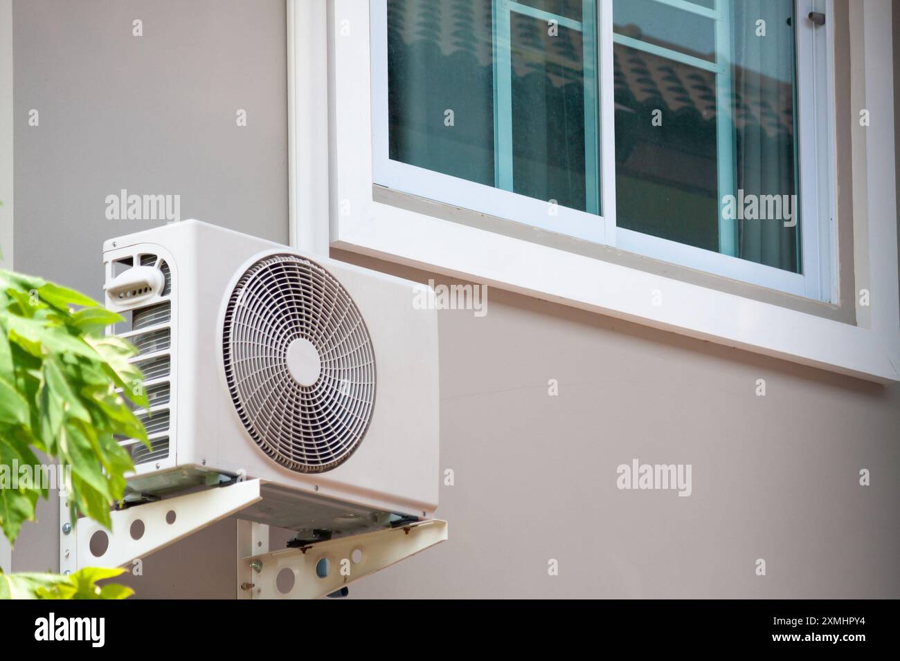 Air conditioner compressor outdoor unit installed outside the house ...