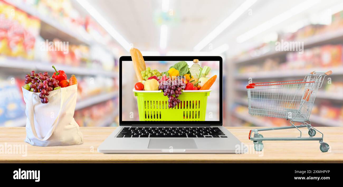 supermarket aisle blurred background with laptop computer and shopping ...
