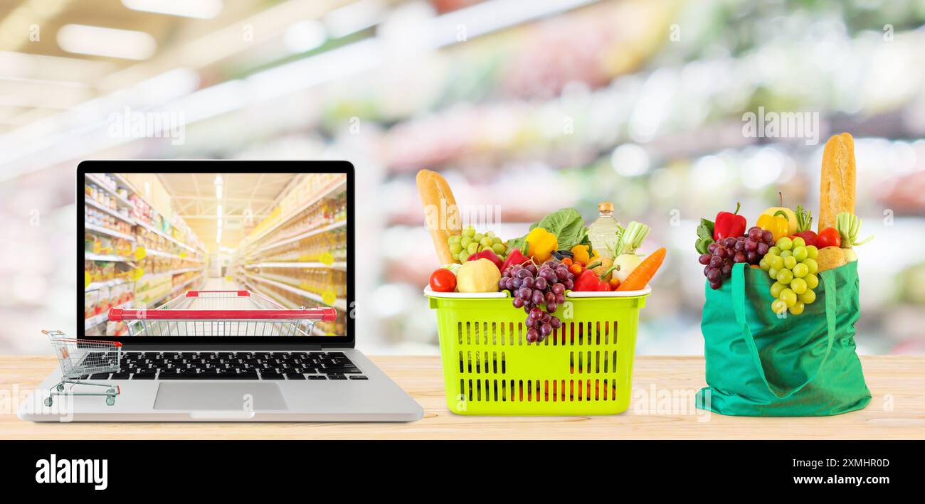 supermarket aisle blurred background with laptop computer and shopping ...
