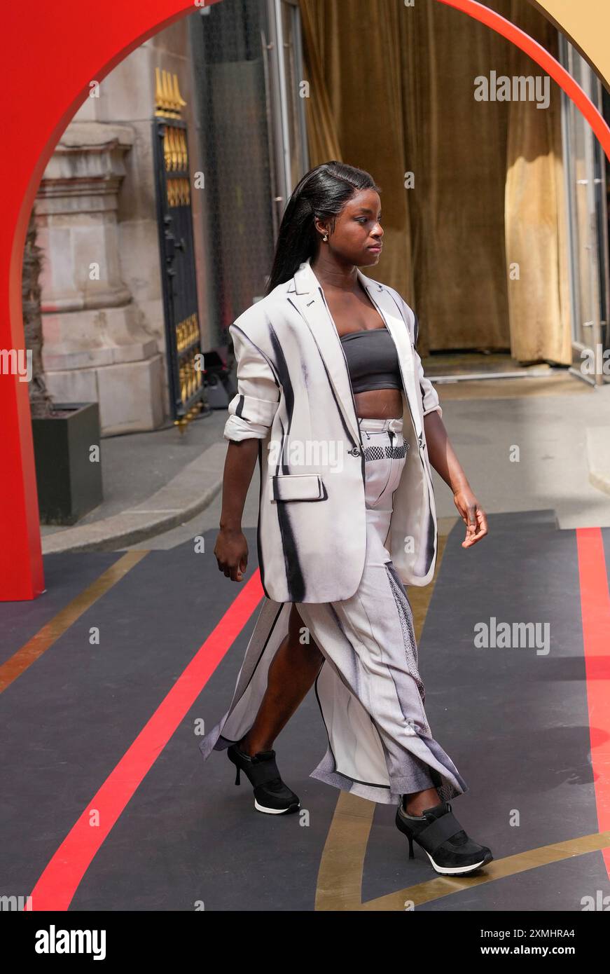 British former soccer player Eniola Aluko wears a creation by Keta ...
