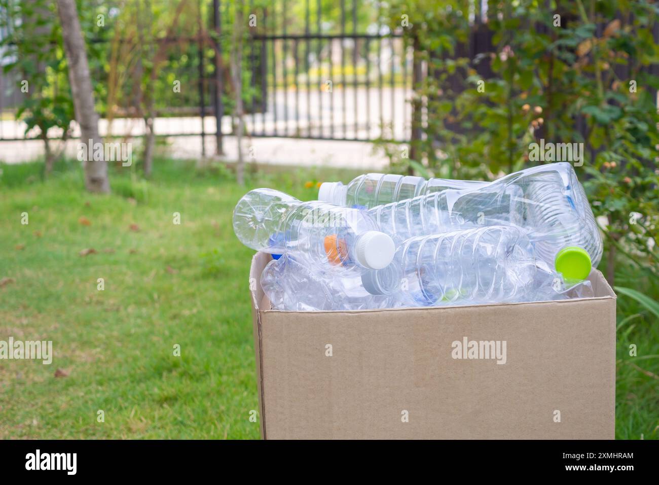 plastic bottles in brown recycle garbage box Stock Photo - Alamy