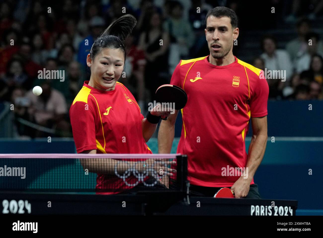 Spain's Xiao Maria, left, with her teammate Alvaro Robles, plays ...