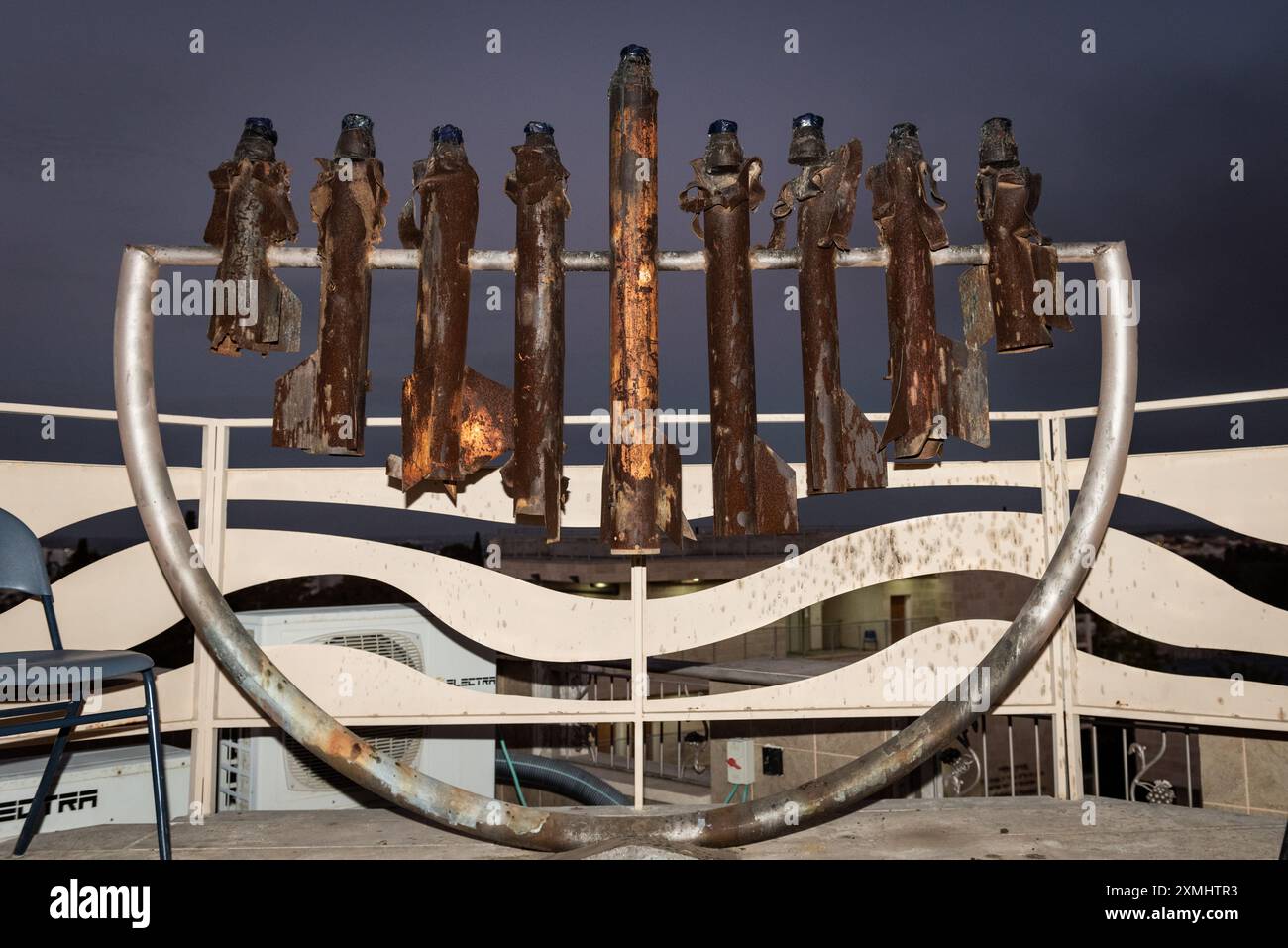 A nine-branched Hanukkah menorah built from fragments of rockets fired ...