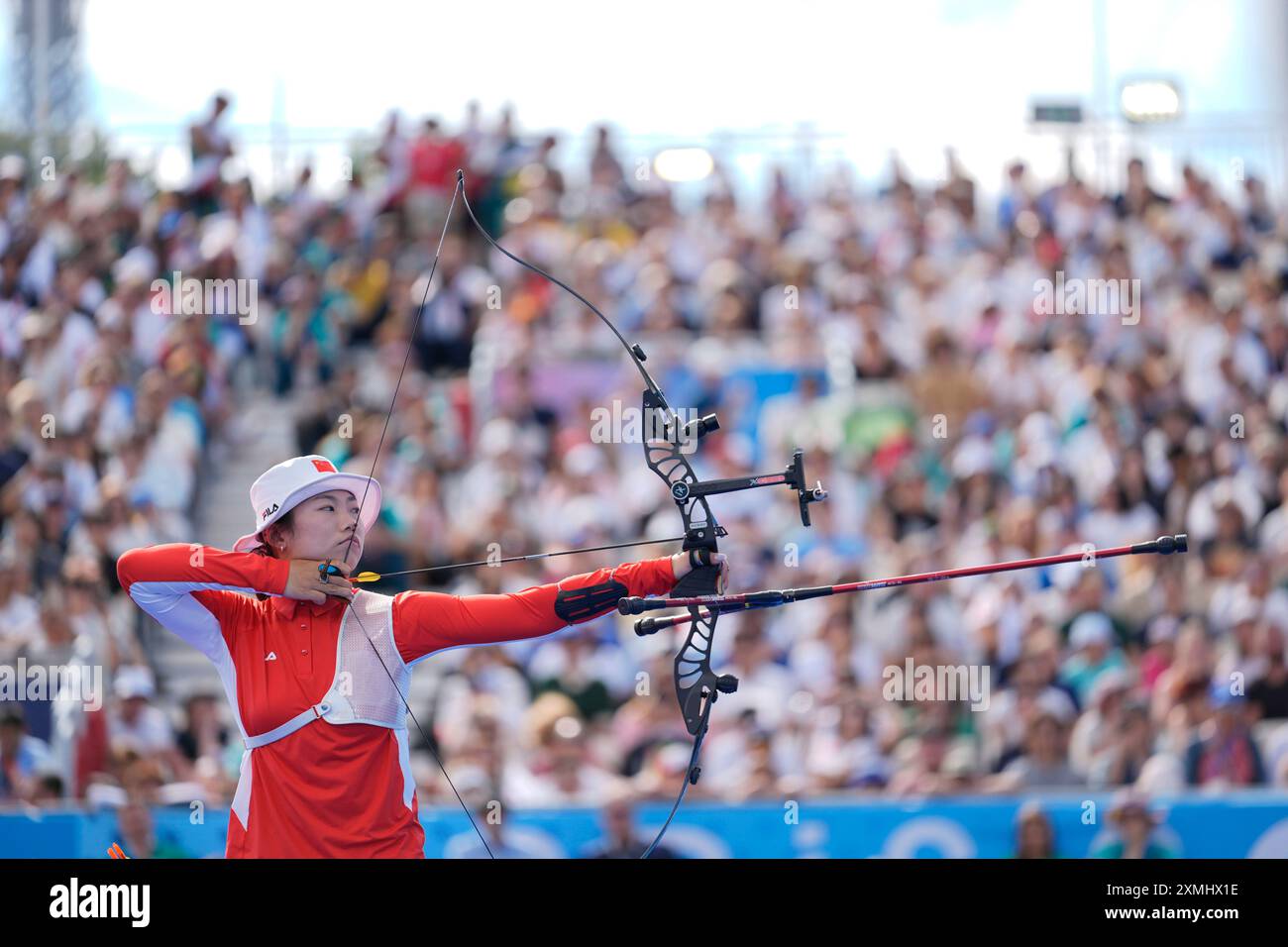 China's Yang Xiaolei shoots during the Archery women's team gold medal match against South Korea ...