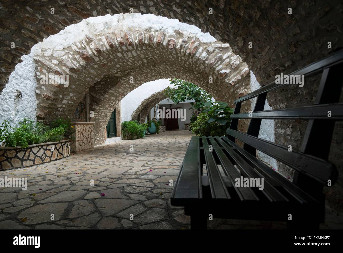 View under the arches of the monastery Stock Photo - Alamy