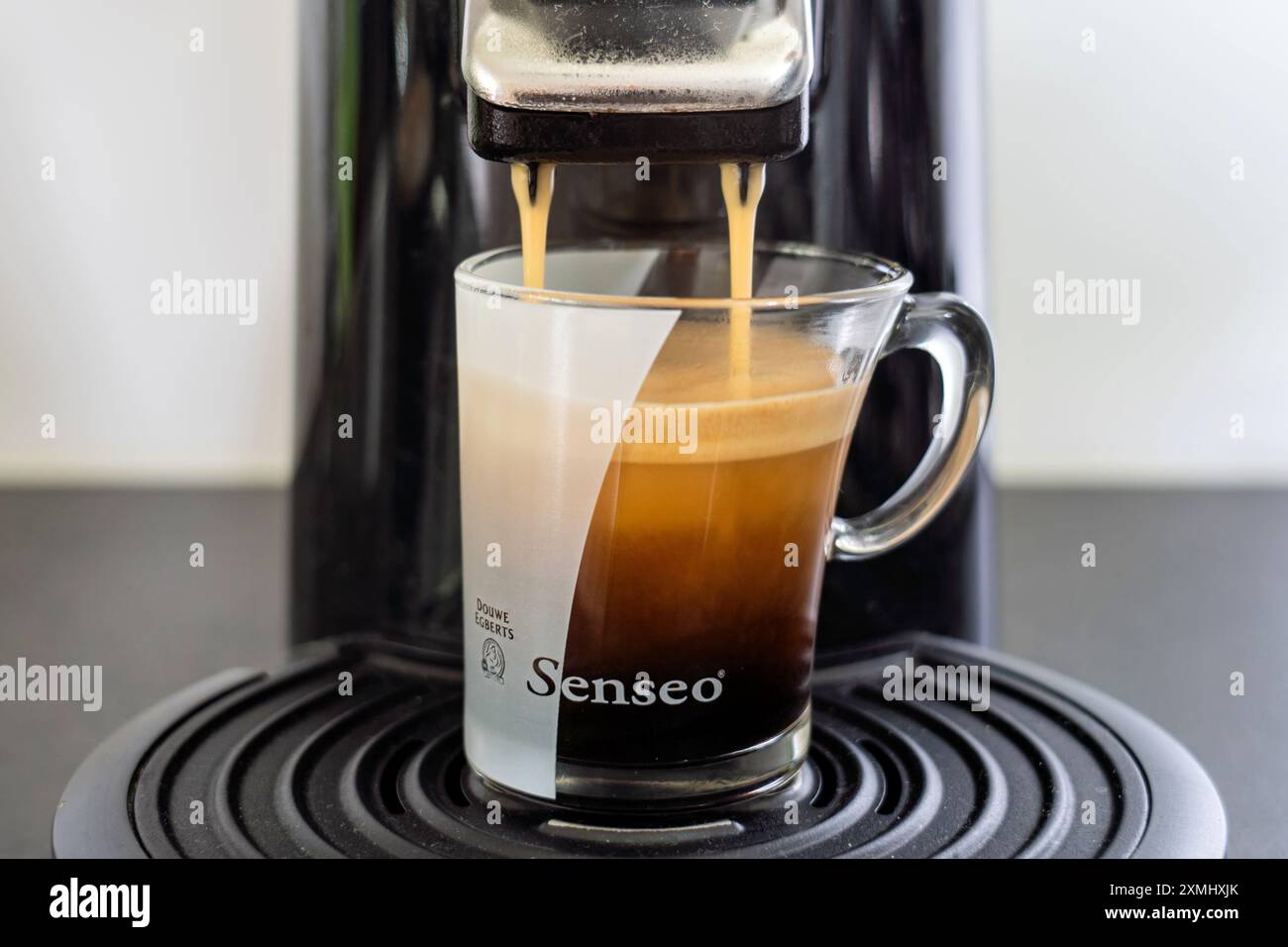 Senseo glass cup with freshly brewed coffee from coffee pad machine ...