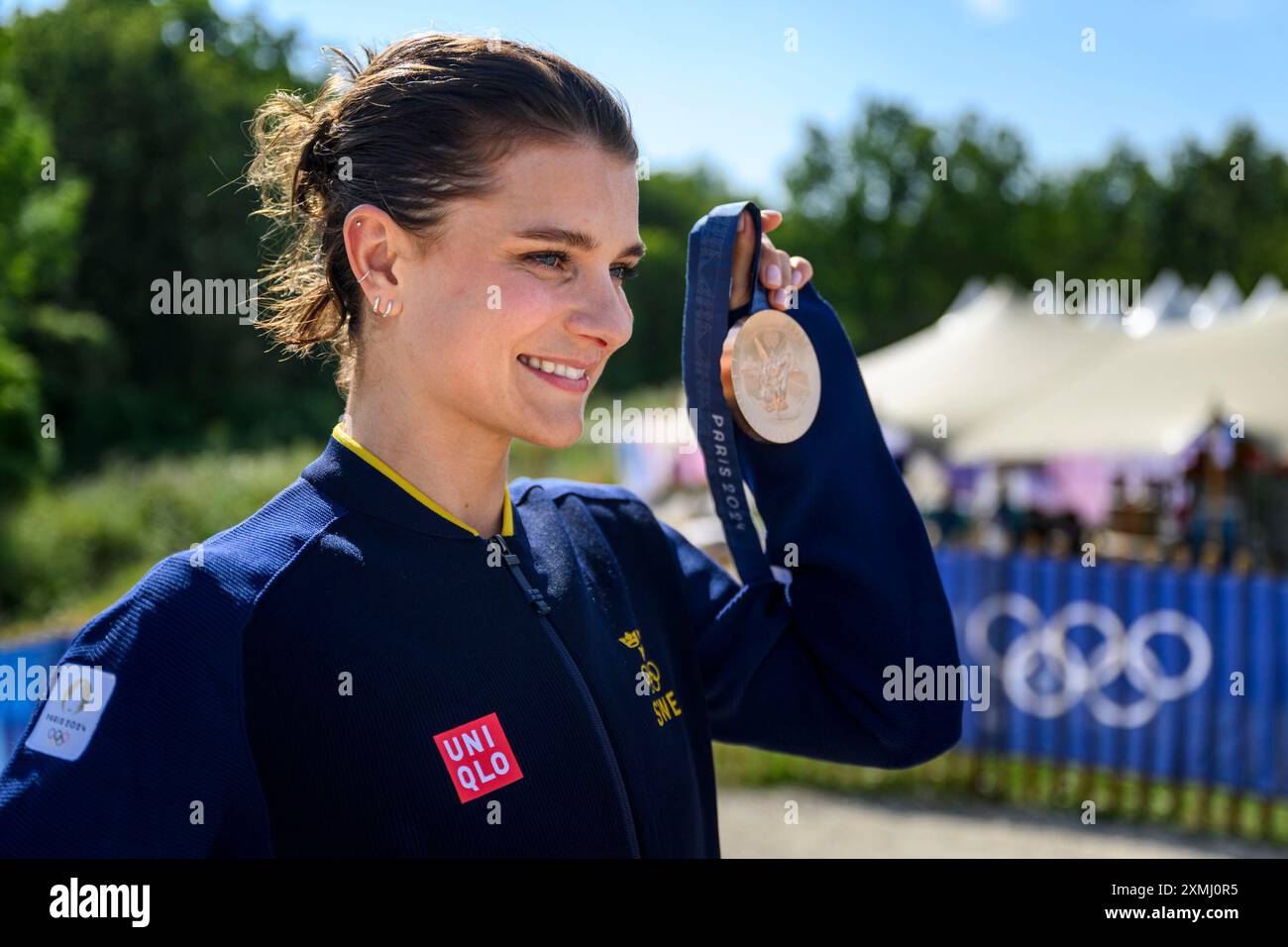 Jenny Rissveds of, Sweden. , . celebrates with her bronze medal after ...