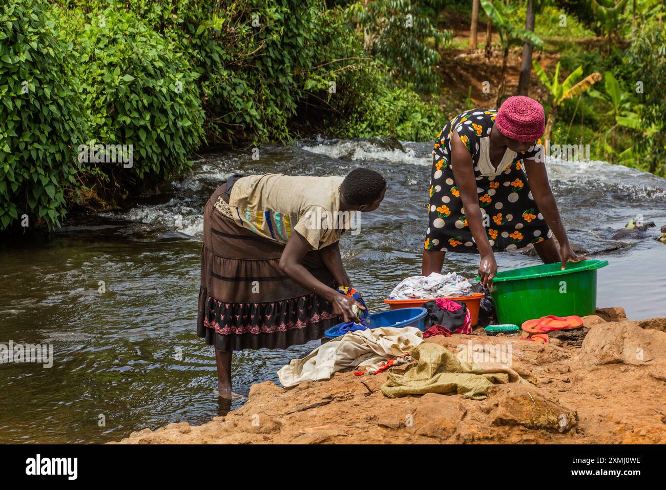 SIPI, UGANDA - FEBRUARY 28, 2020: Local women doing laundry in Sipi ...