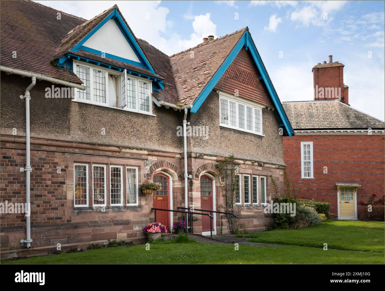 Port Sunlight, Wirral, UK - July 26th 2024 -Red coloured painted arched ...