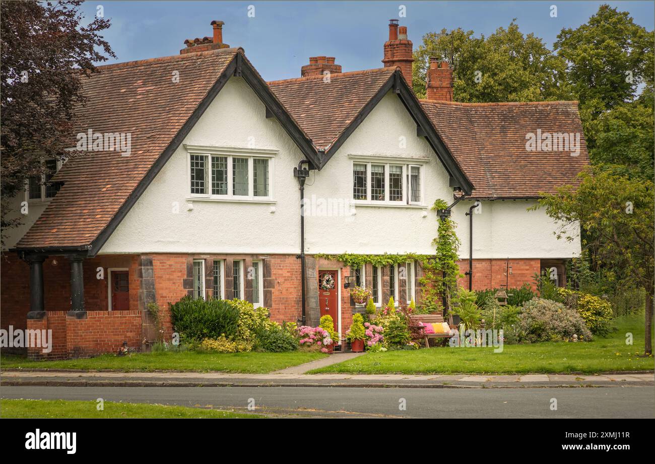 Port Sunlight, Wirral, UK - July 26th 2024 -White painted house with ...