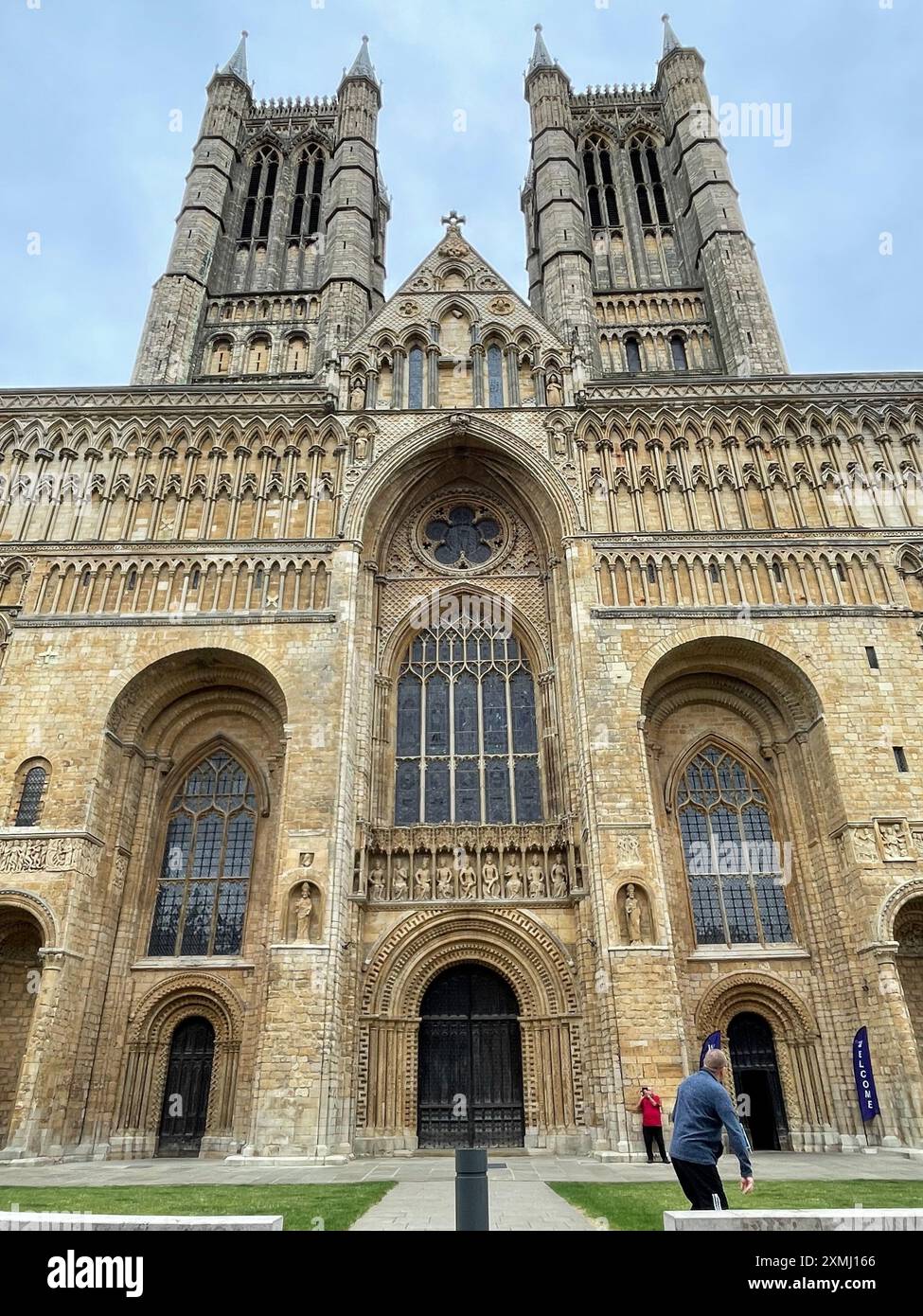 View of the front facade of Lincoln Cathedral in the UK, showcasing the ...