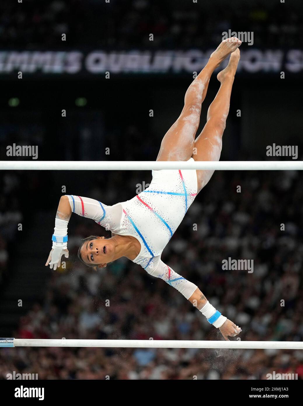 Marine Boyer, of France, competes on the uneven bars during a women's ...