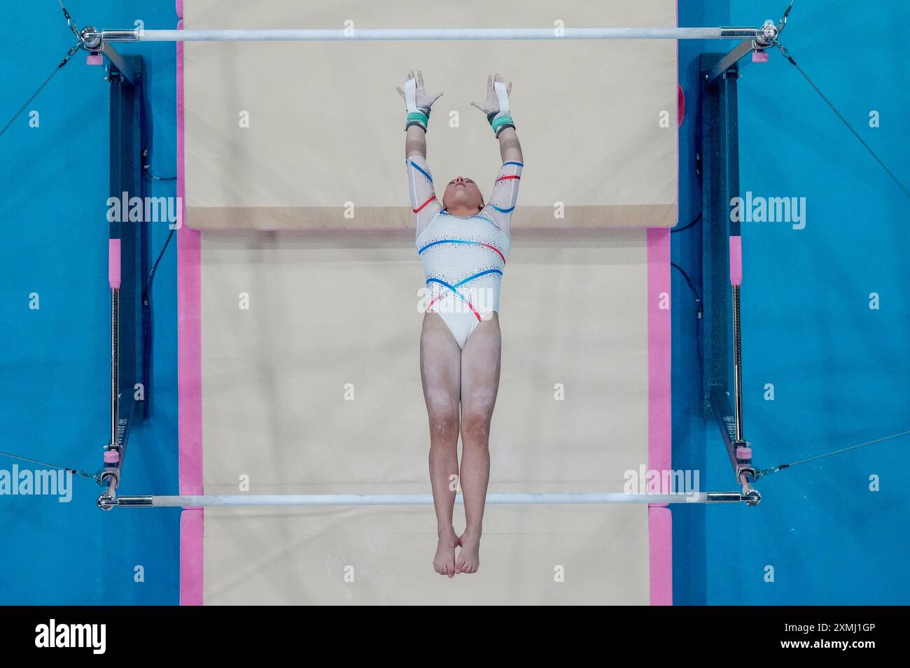 Ming van Eijken, of France, performs on the uneven bars during a women ...