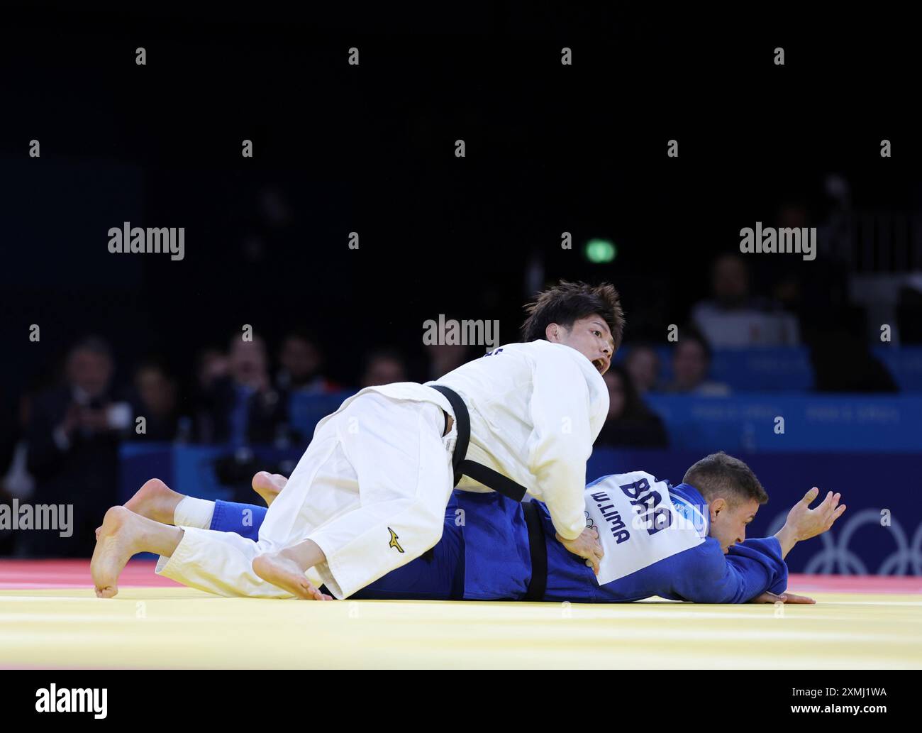 Japan's ABE Hifumi (white) and Brazil's LIMA William (blue) compete ...