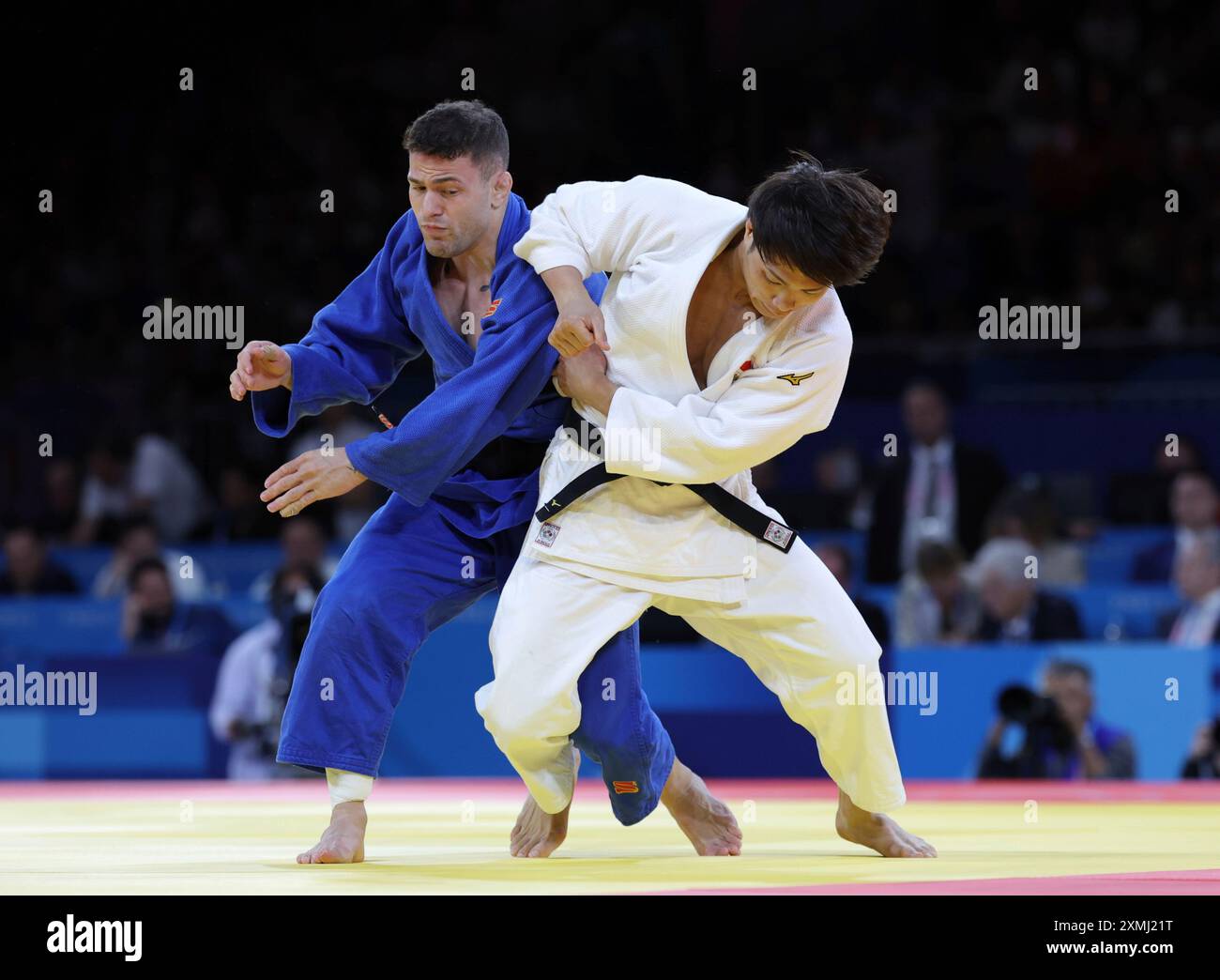 Japan's ABE Hifumi (white) and Brazil's LIMA William (blue) compete ...