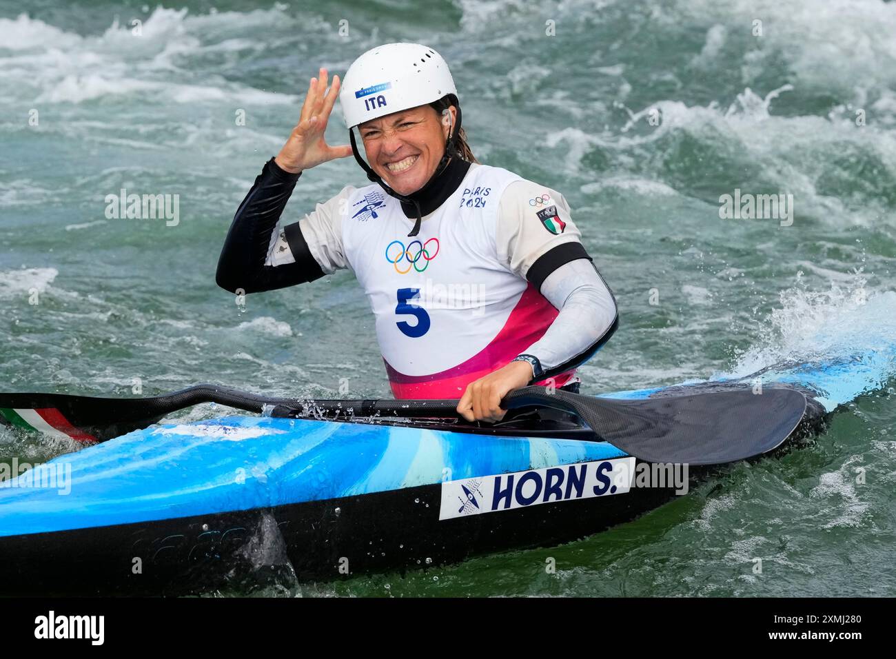 Stefanie Horn of Italy reacts at the finish area of the women's kayak ...