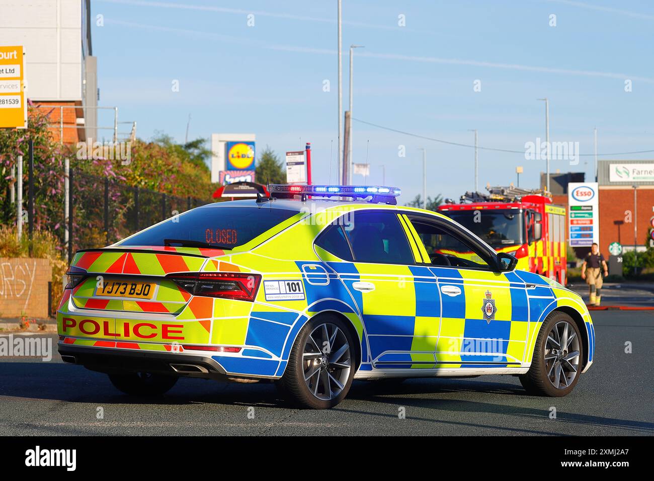Vehicles from West Yorkshire Police Force used as roadblocks at a fire ...