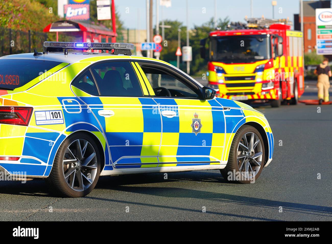 Vehicles from West Yorkshire Police Force used as roadblocks at a fire ...
