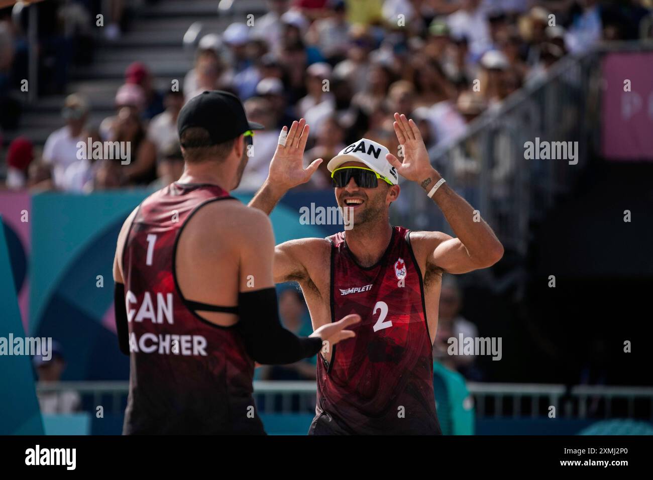 Canada's Daniel Dearing celebrates during the men's pool E beach ...