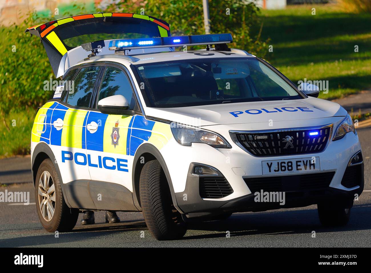 Vehicles from West Yorkshire Police Force used as roadblocks at a fire ...