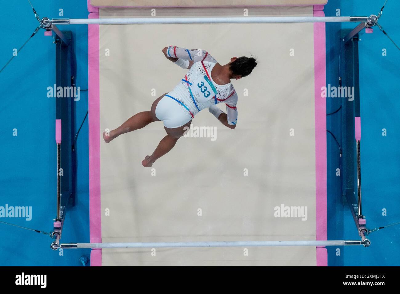 Melanie dos SANTOS de Jesus, of France, falls from the uneven bars ...