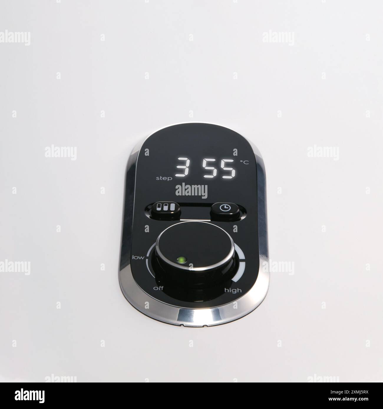 Close-up modern tanked boiler thermostat interface. Digital display of ...