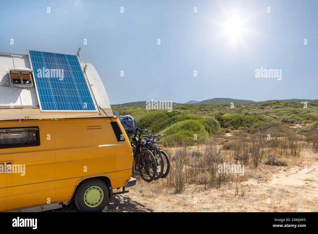 Yellow Camper Van with Solar Panel in Desert Stock Photo - Alamy