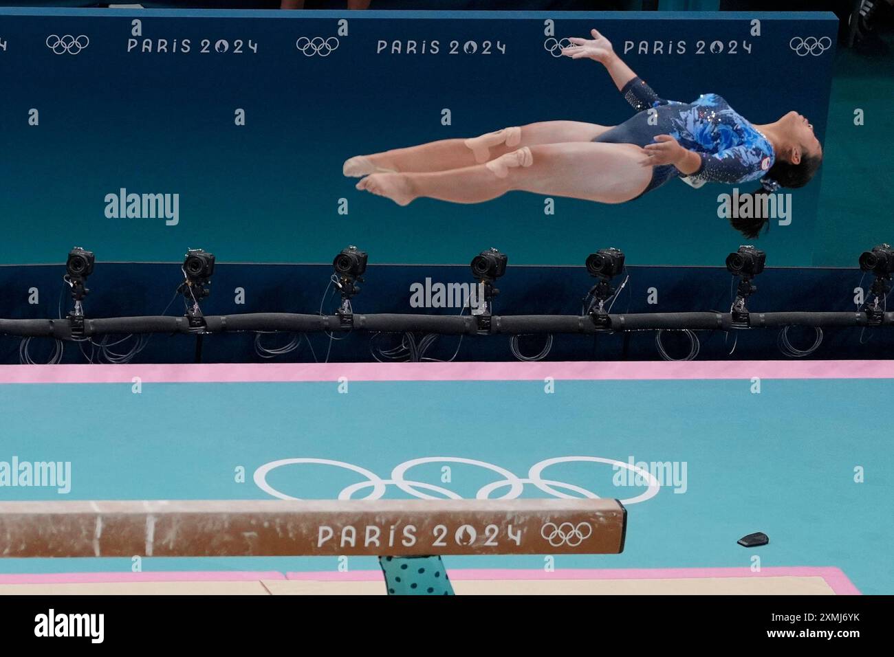 Cassandra Lee, of Canada, performs on the beamduring a women's artistic ...