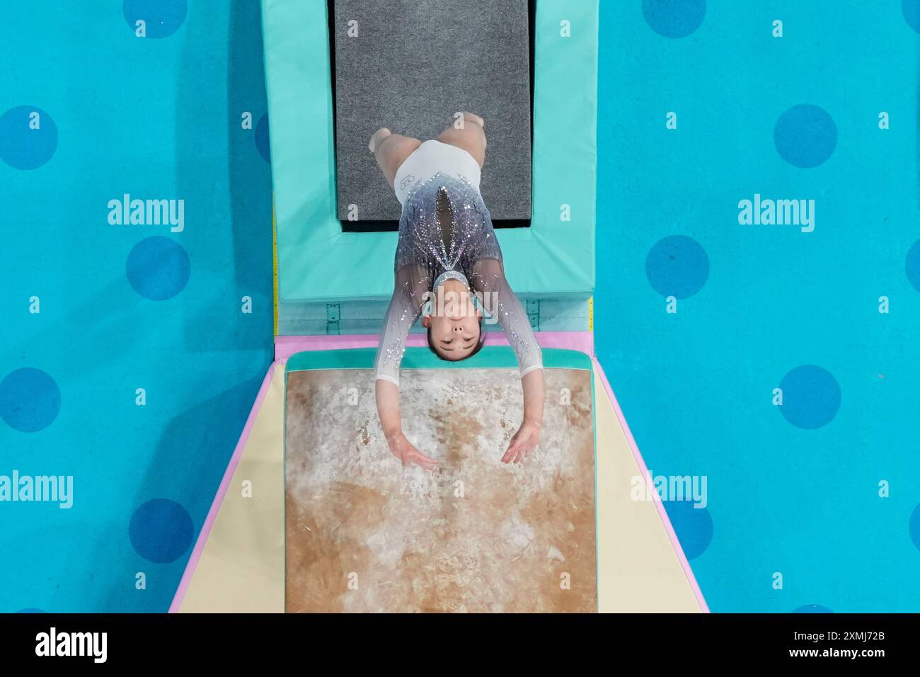 Solyi Shin, of South Korea, performs on the vault during a women's ... Solyi Shin, of South Korea, performs on the vault during a women's ...