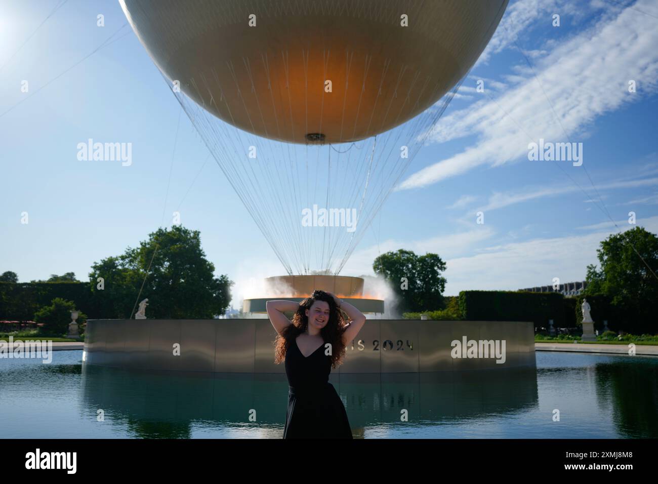 Solène Ratinaud poses for a picture in front of the cauldron with the ...