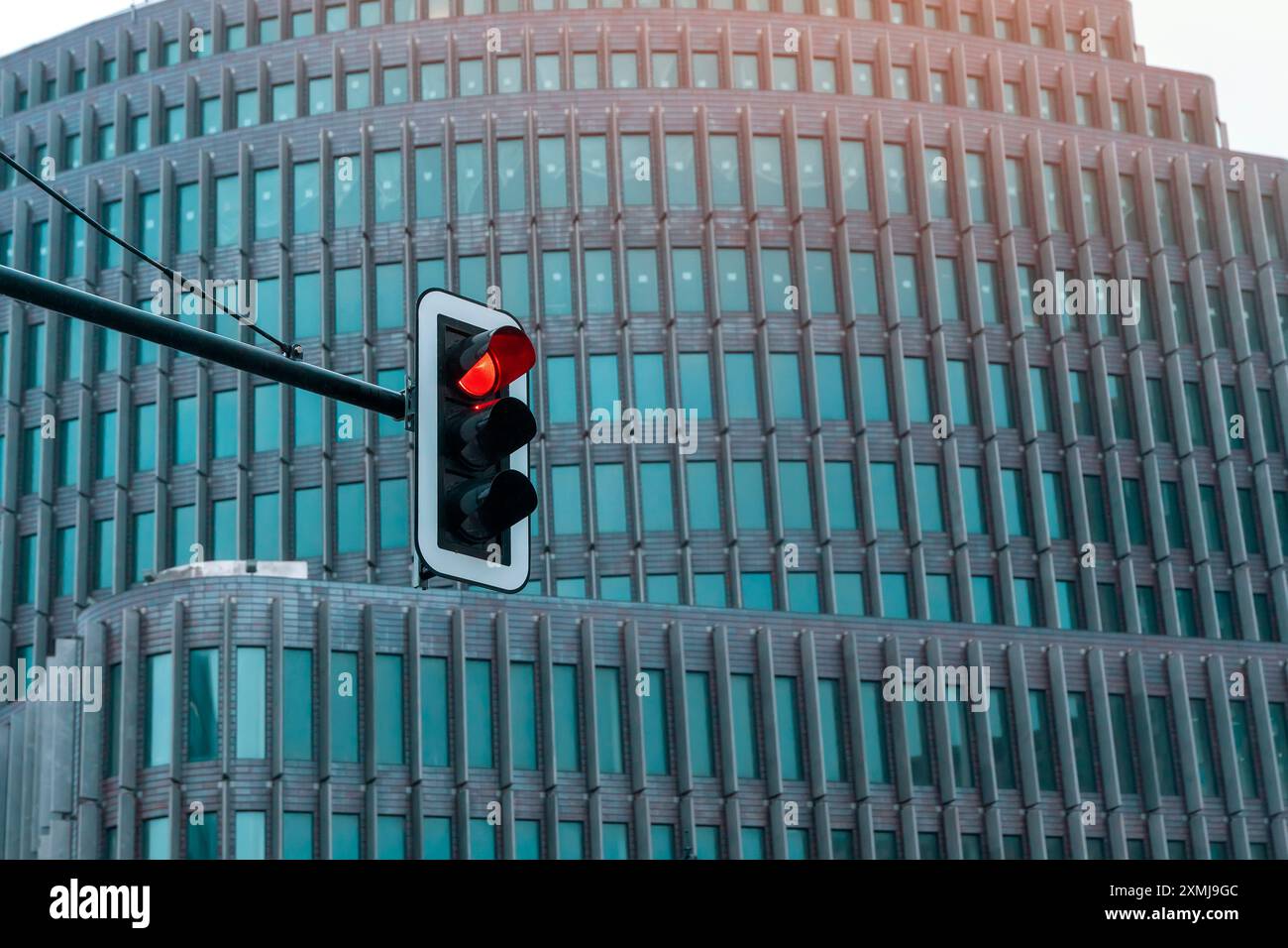 Traffic light against the big building Stock Photo - Alamy