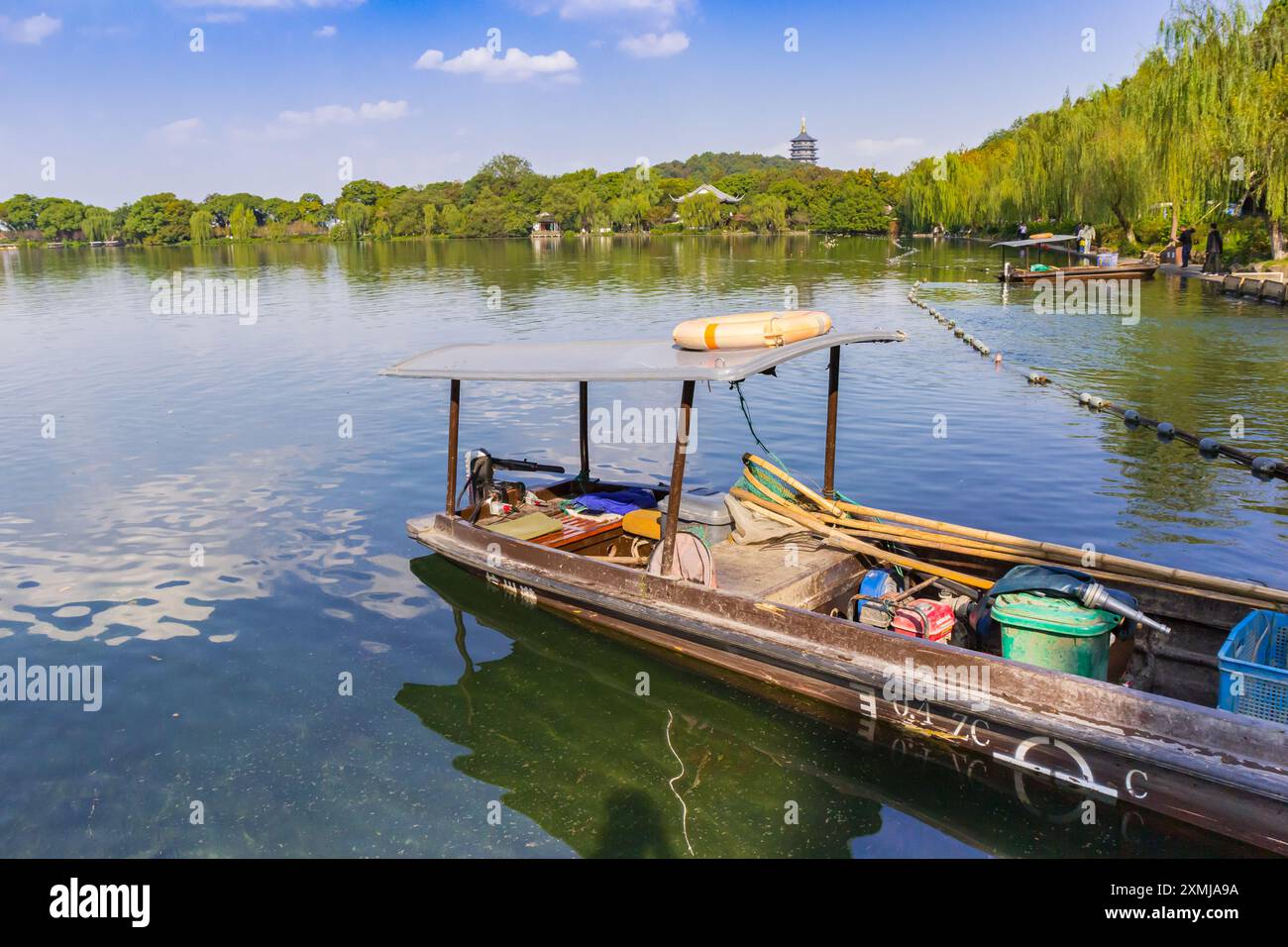 Traditional wooden fishing boat in the West Lake in Hangzhou, China ...