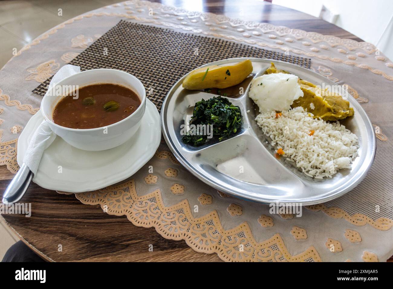Lunch in Uganda - bean soup with matoke (mashed plantains), rice, posho ...