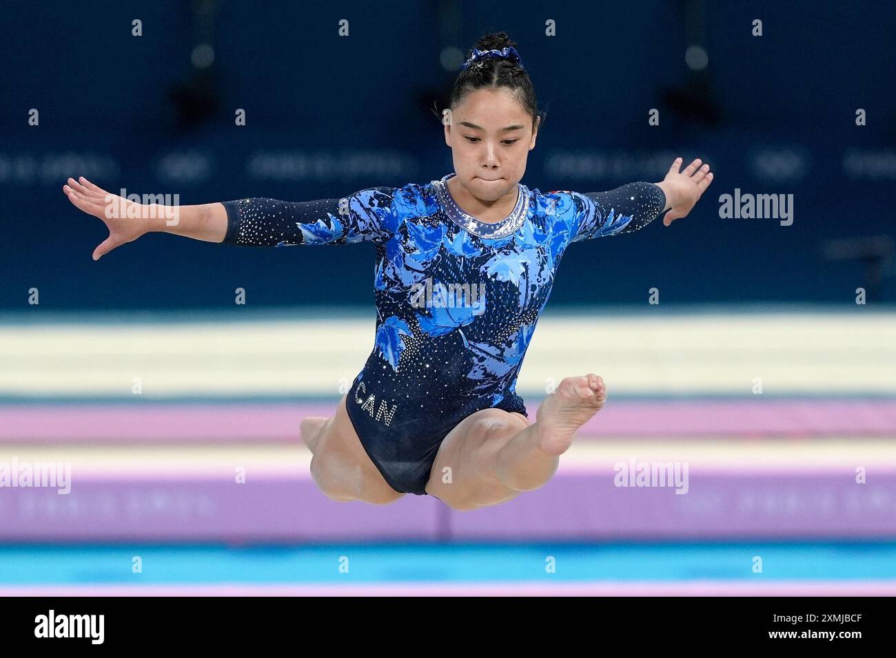 Aurelie Tran, of Canada, competes on the balance beam during a women's ...