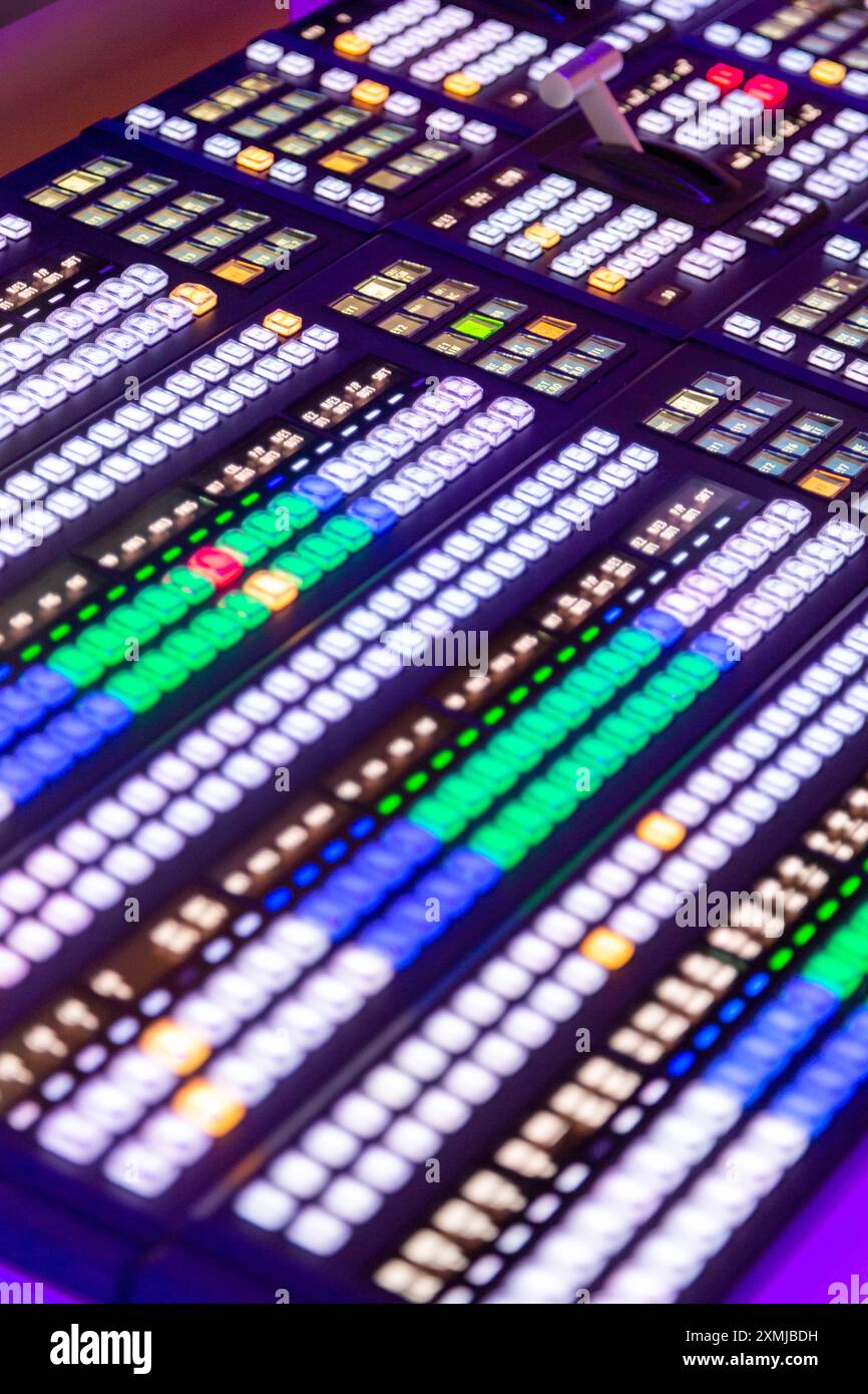 Video switcher. Modern video mixer panel with many colored, glowing ...