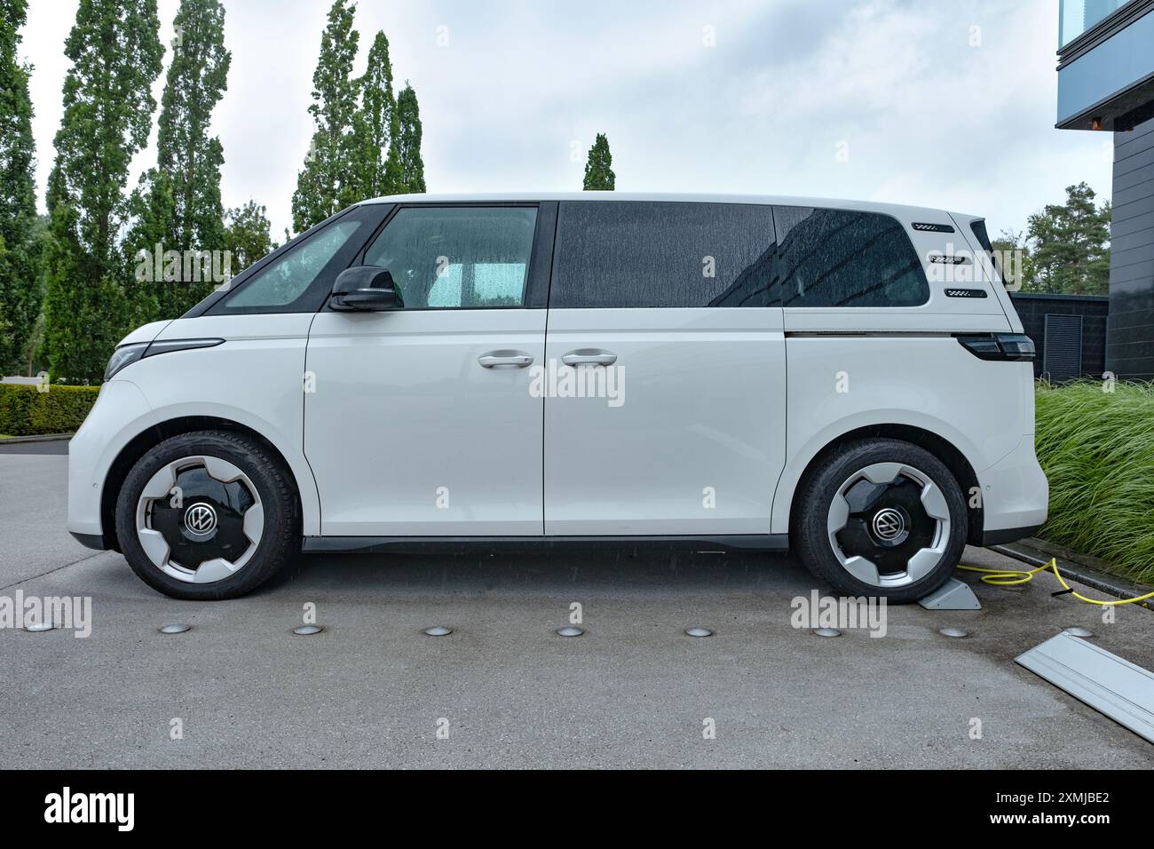 classic White electric bus Volkswagen ID Buzz charging, Old-school cool ...