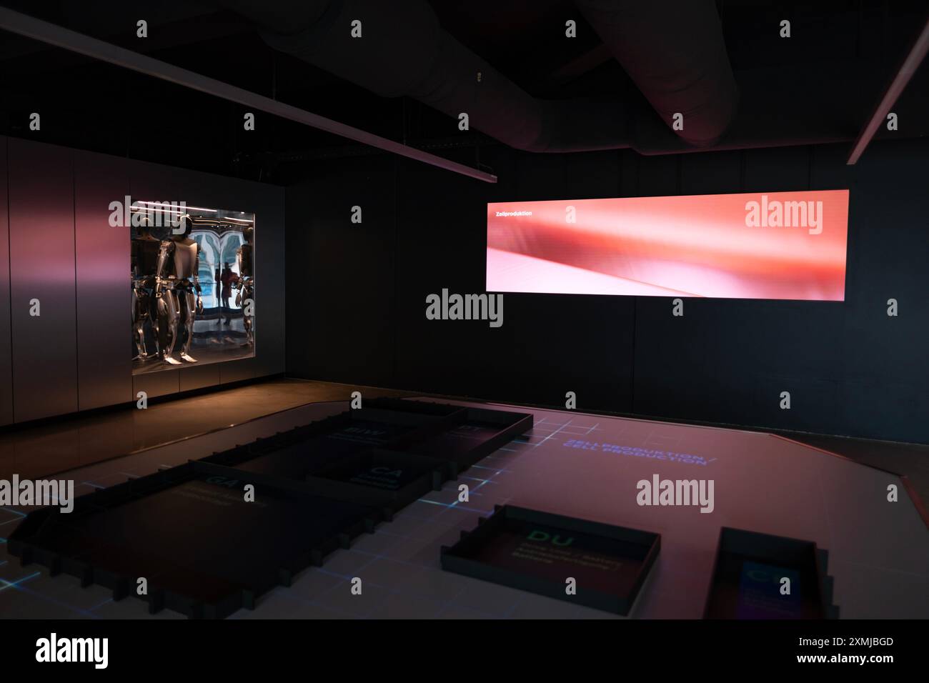 Tesla Bot Optimus robotic humanoid in Tesla's Giga Berlin lobby, large ...