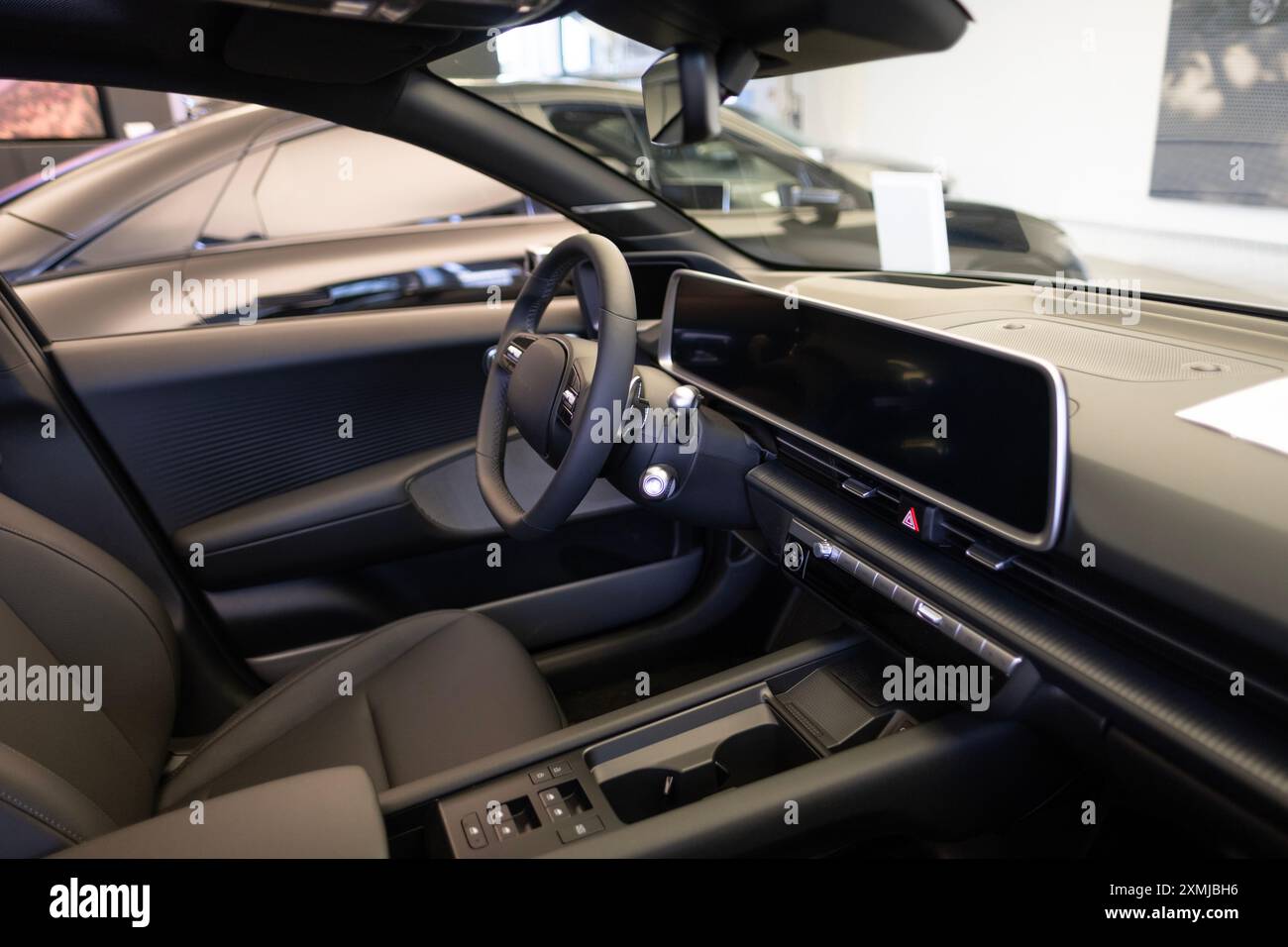 Interior, cockpit of electric streamliner Hyundai IONIQ 6 car, digital ...