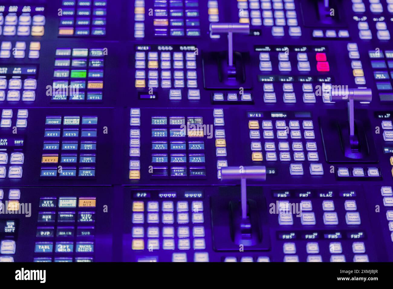 Video mixer panel with many colored, glowing buttons. Live Switcher ...