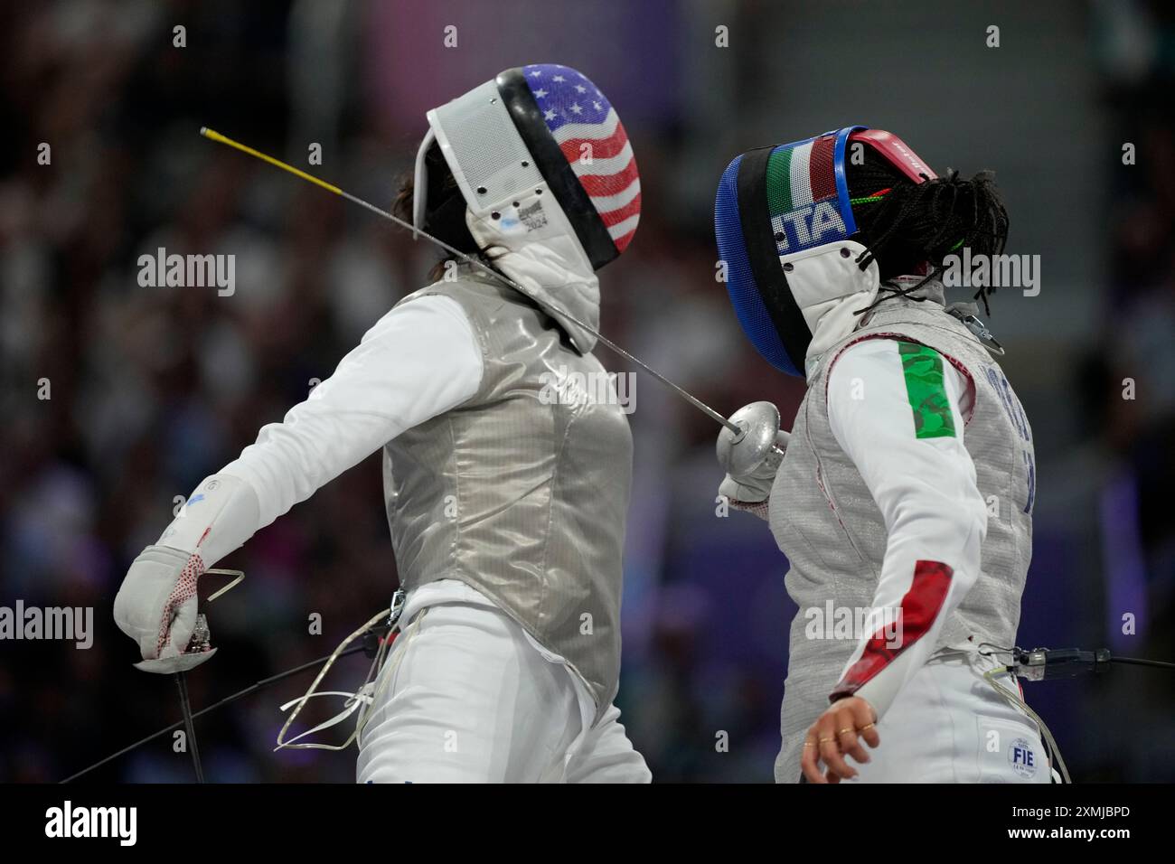 United States' Lee Kiefer, left, competes with Italy's Alice Volpi in ...