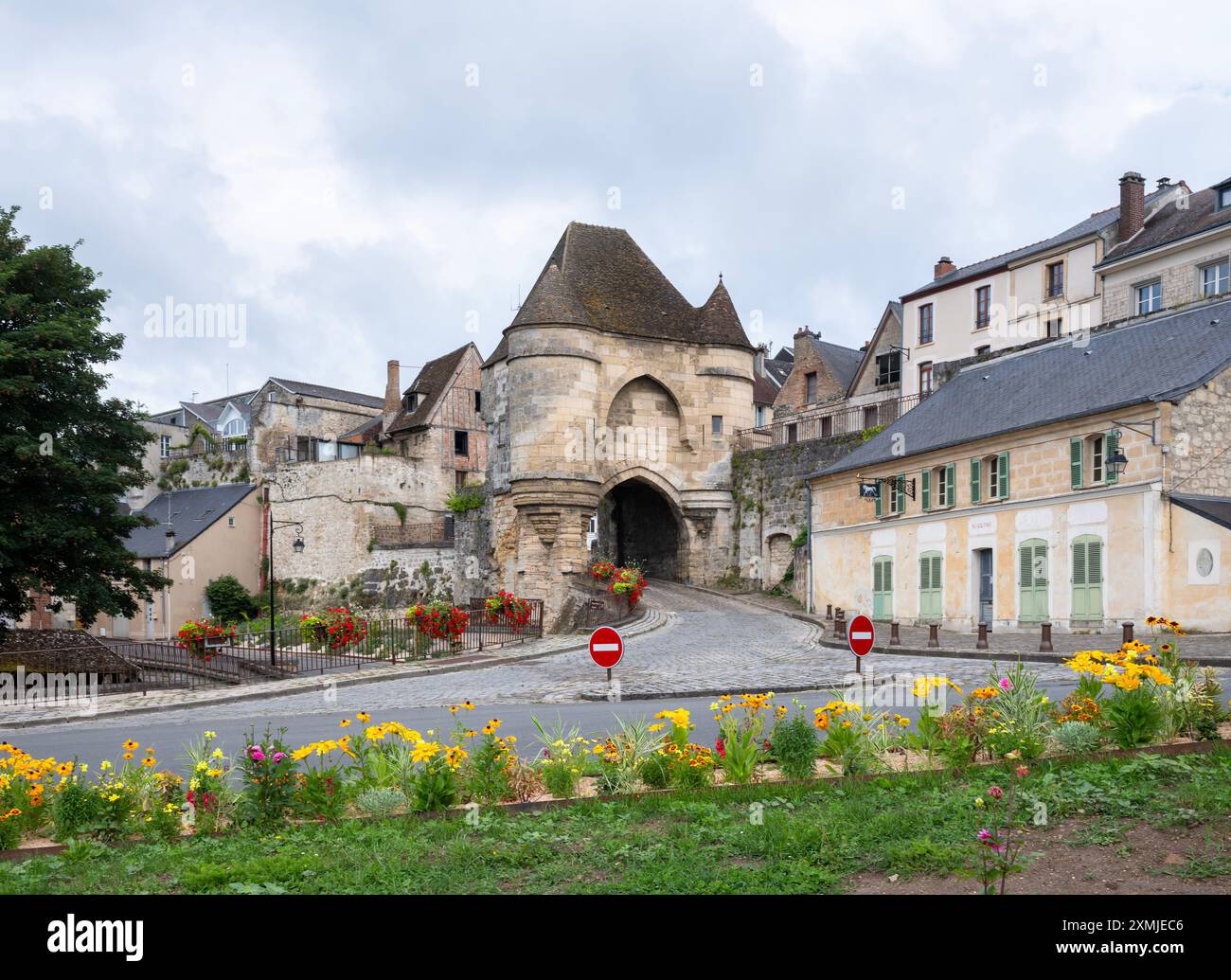 old stone walls and porte d'ardon of old medieval fortified city of ...