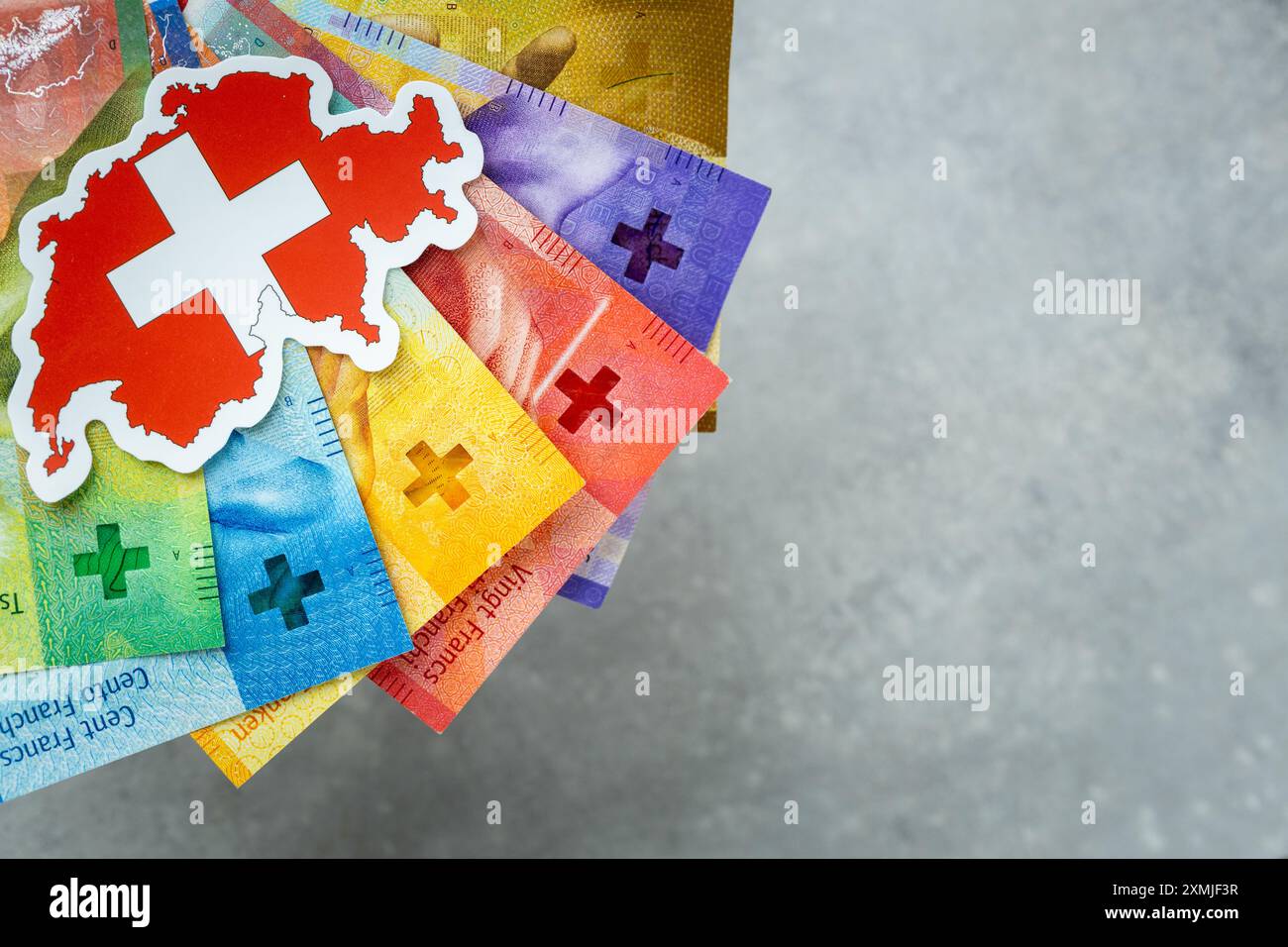 Switzerland money and national emblem, gray background, copy space ...
