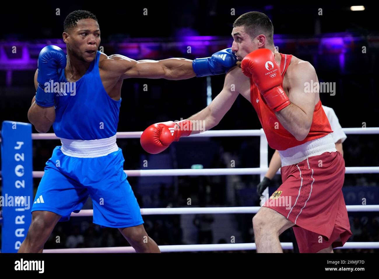 Mozambique's Tiago Muxanga, left, punches Germany's Magomed Schachidov ...