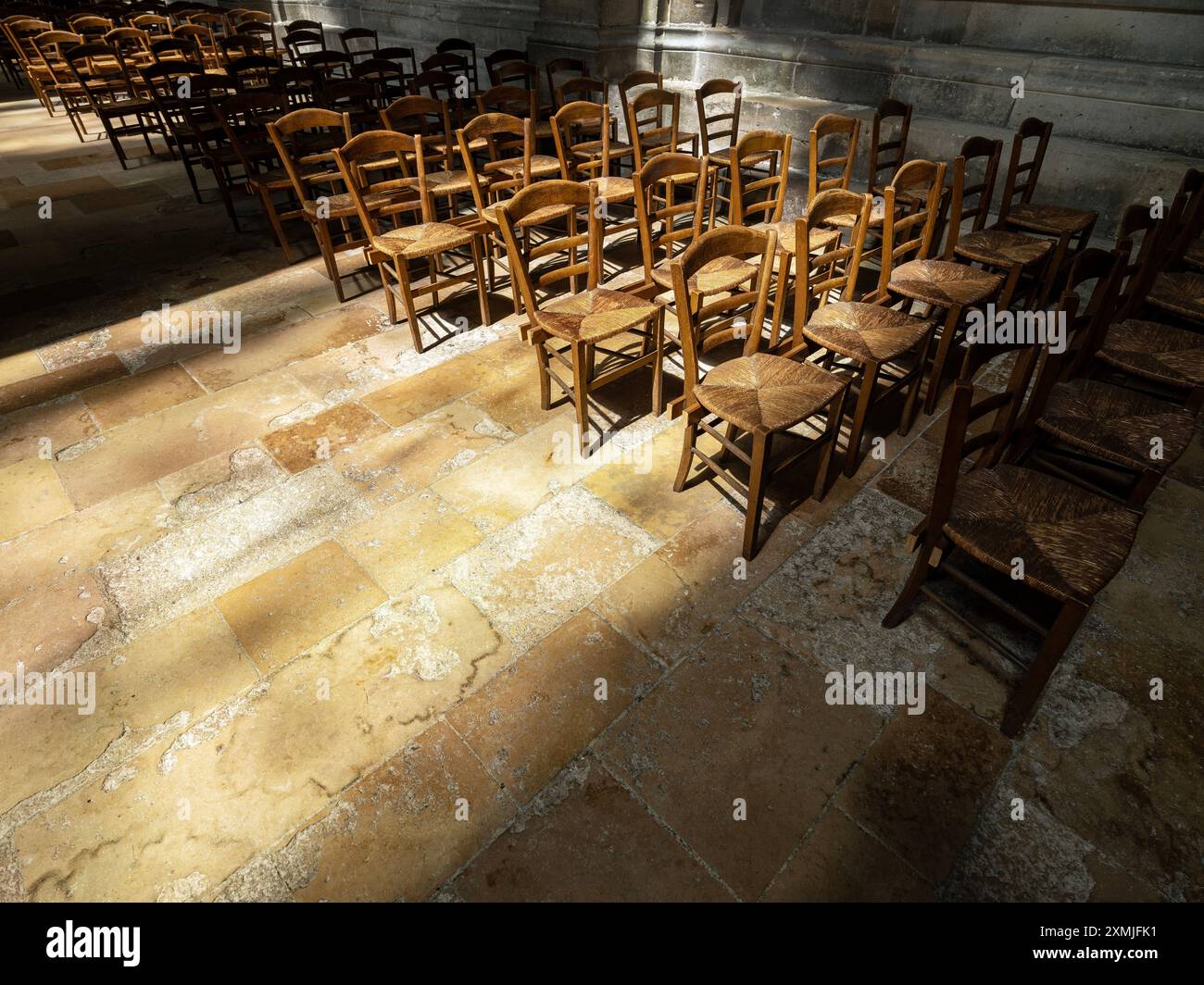 old chairs on flagstone floor in interior of famous gothic cathedral of ...