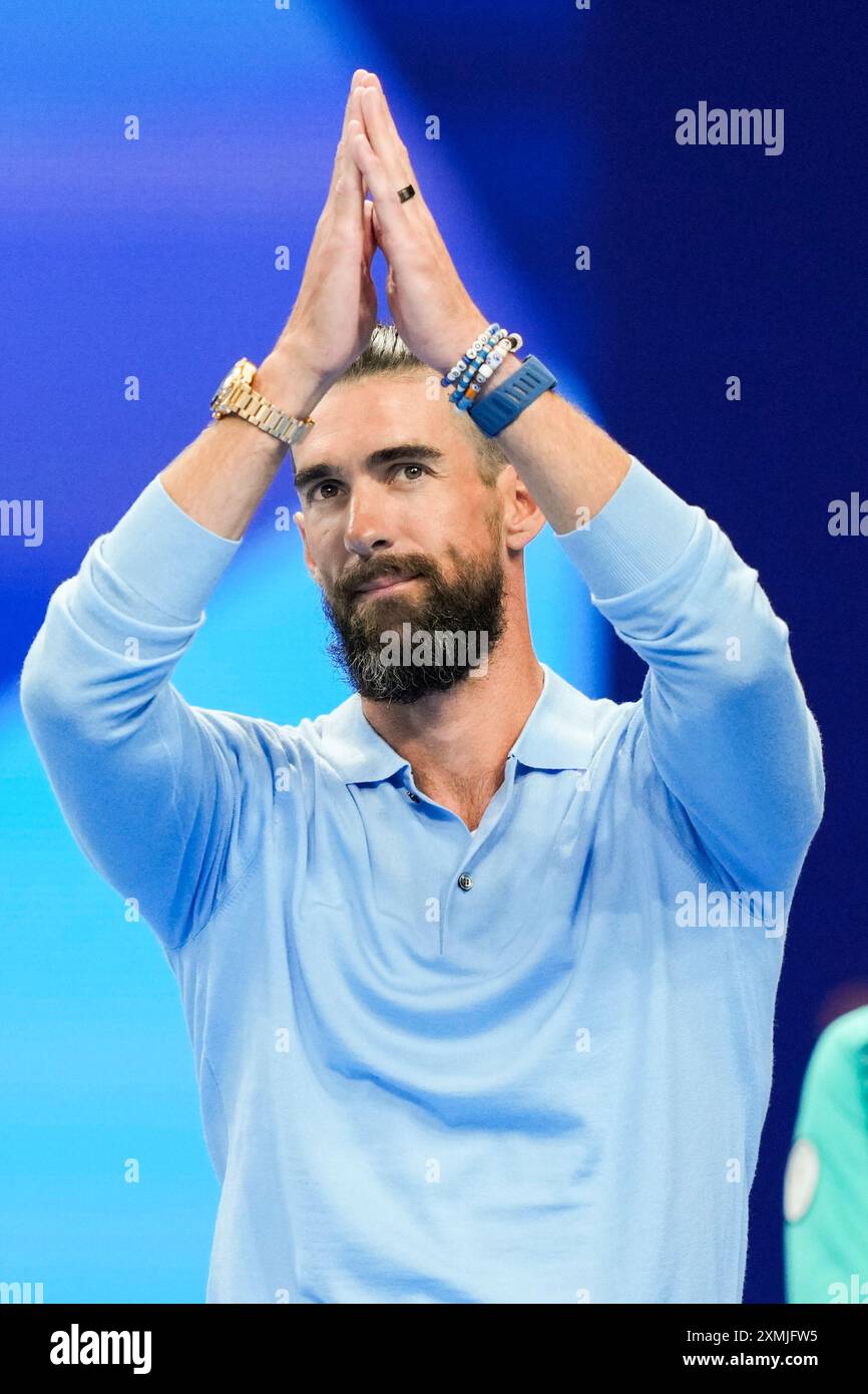 Former Olympic champion Michael Phelps, from the United States, greets ...