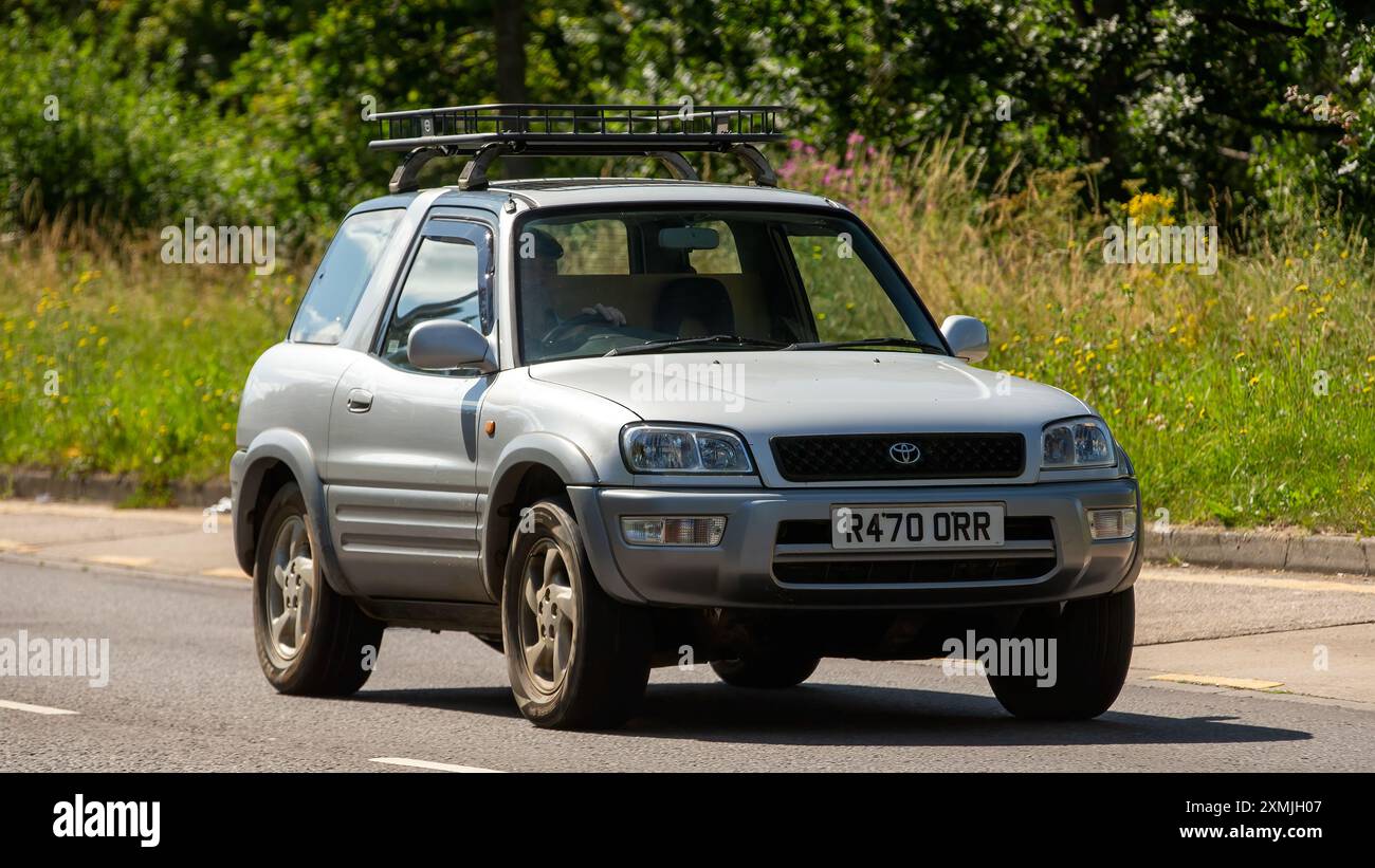 Milton Keynes,UK - July 28th 2024: 1998 silver Toyota Rav4 car driving ...